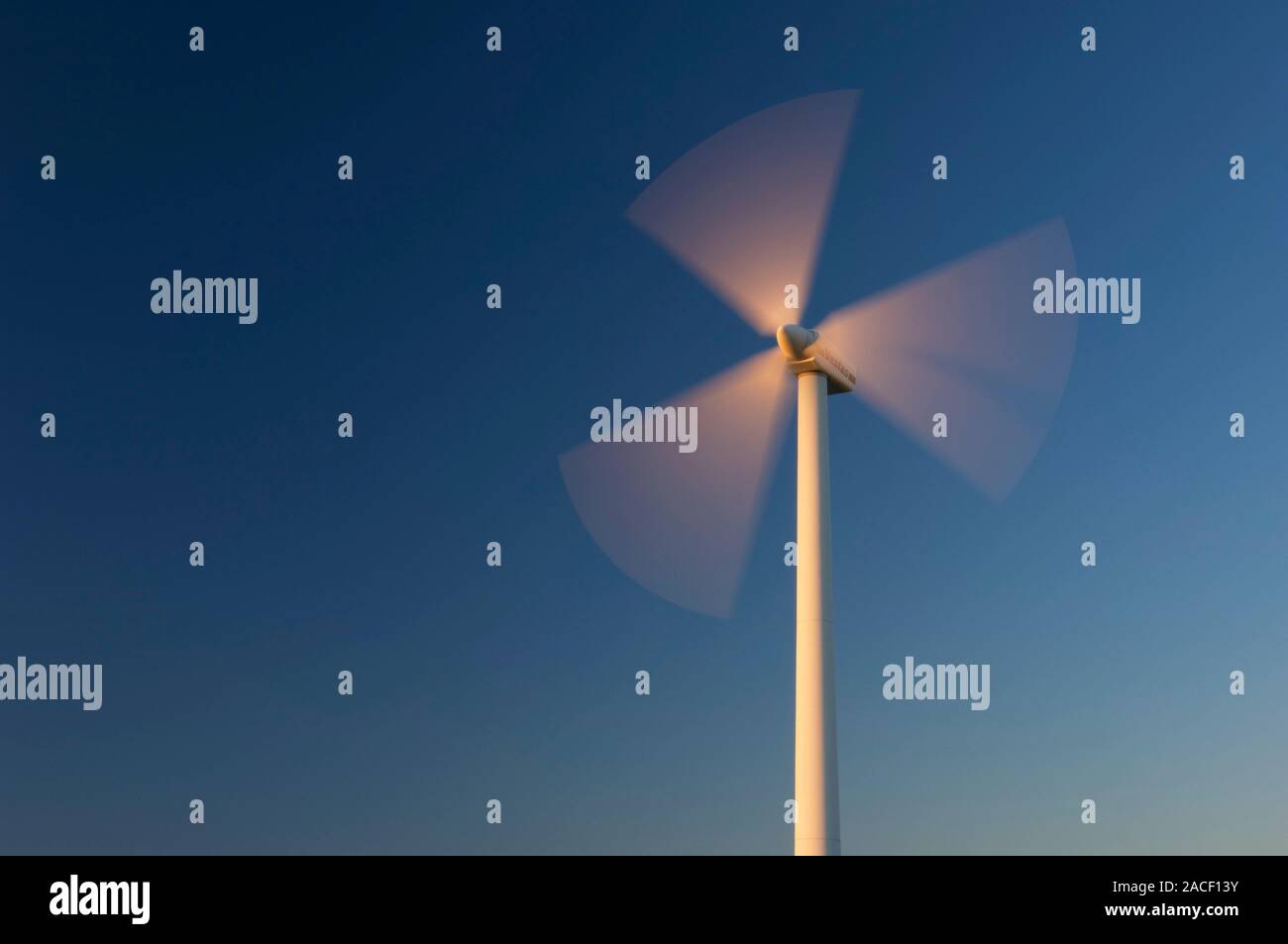 Wind turbine rotating, time-exposure image. Wind power is a renewable ...