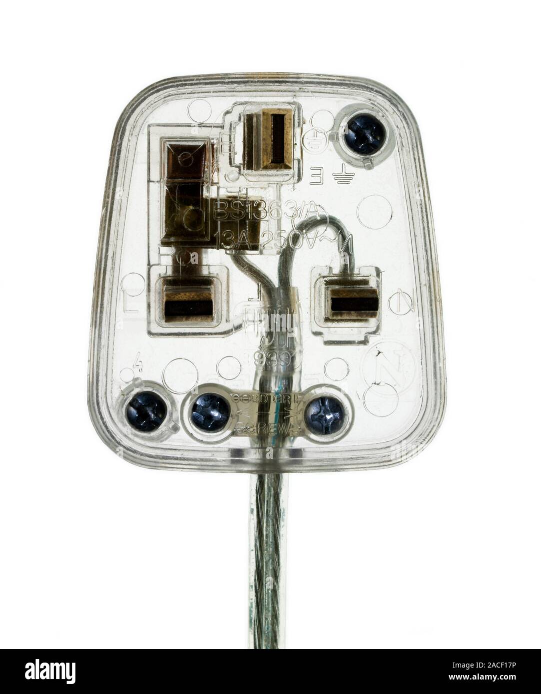 Transparent plug. Top of a transparent, plastic UK 13-Amp mains plug ...