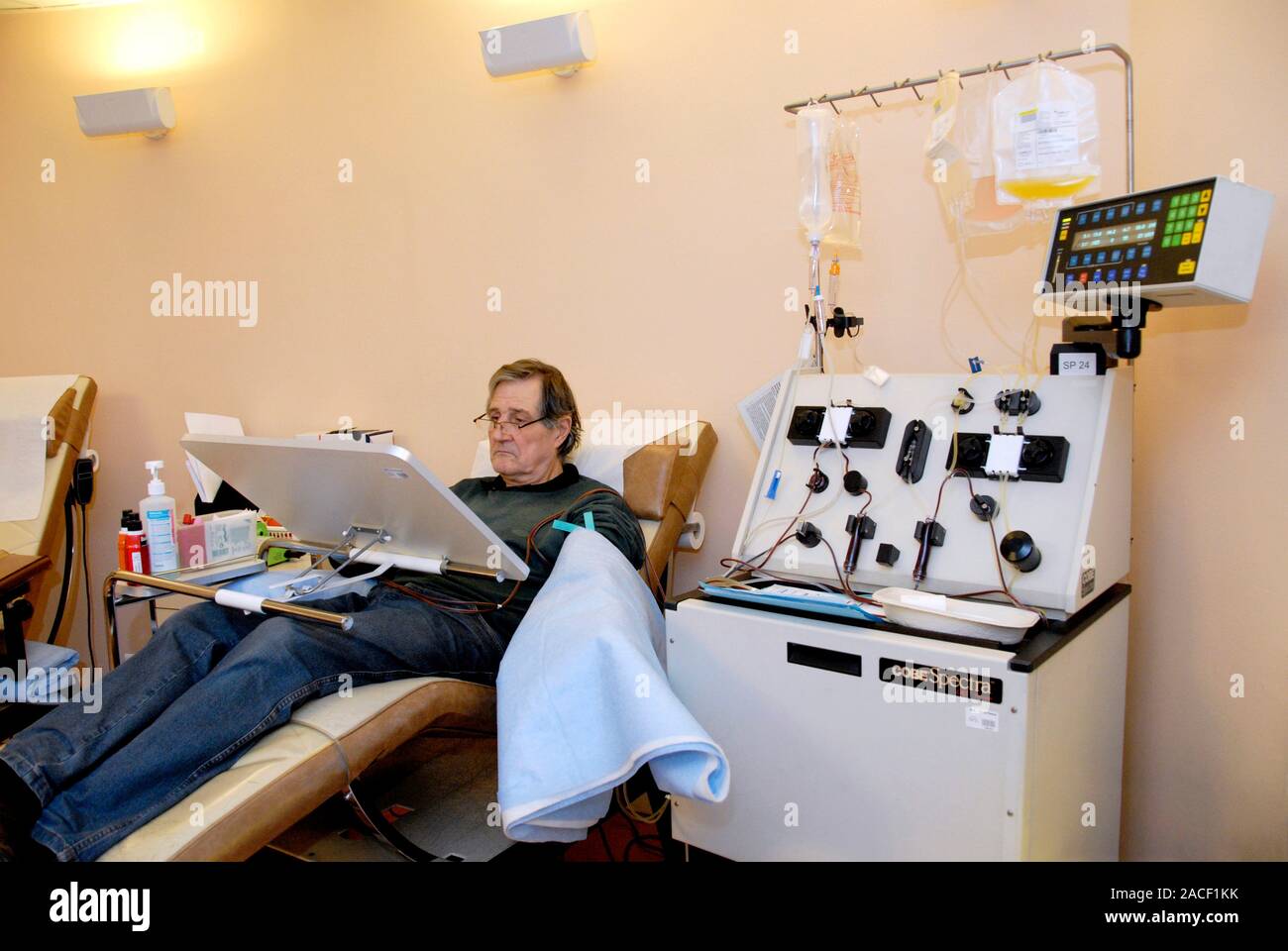 Man donating blood platelets (blood clotting components) in an ...