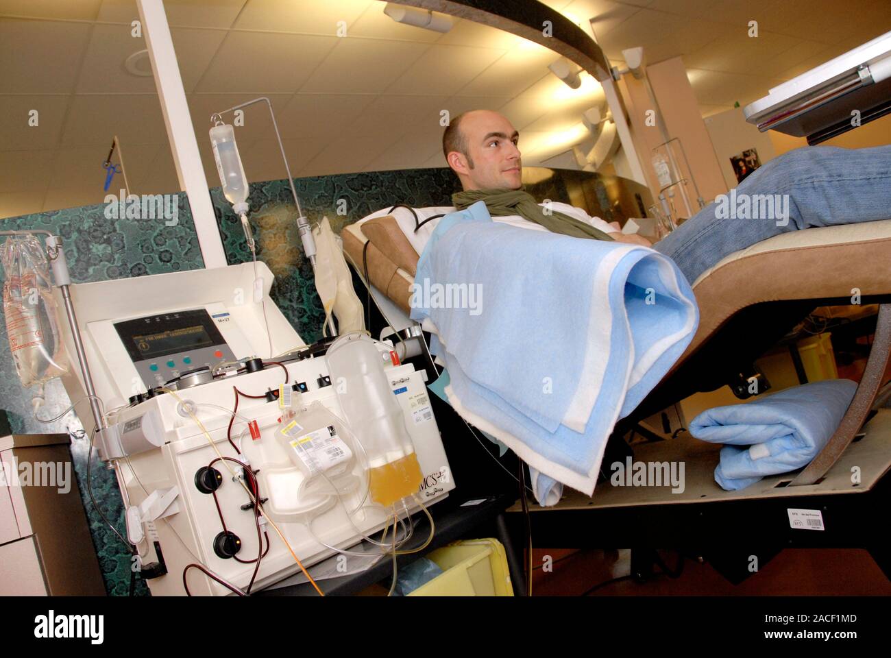 Man donating blood platelets (blood clotting components) in an ...