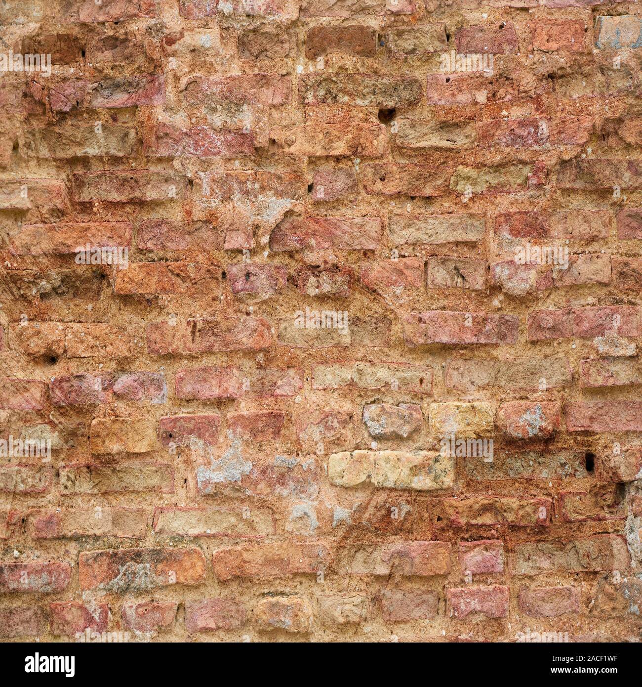 Pink tone brick wall texture background with hues of brown, terra cotta ...