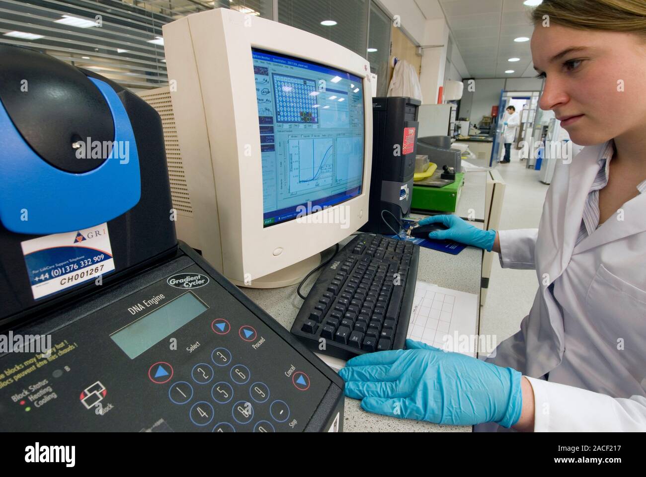 Testing food for GM contamination. Researcher using a RT-PCR (reverse ...