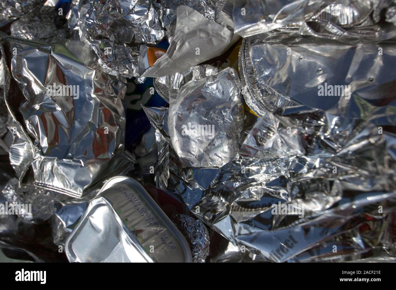 Metal food container recycling. Pile of used metal food containers ...