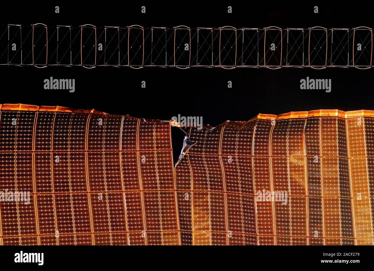 Damaged ISS solar array. View of a damaged solar array wing on the ...