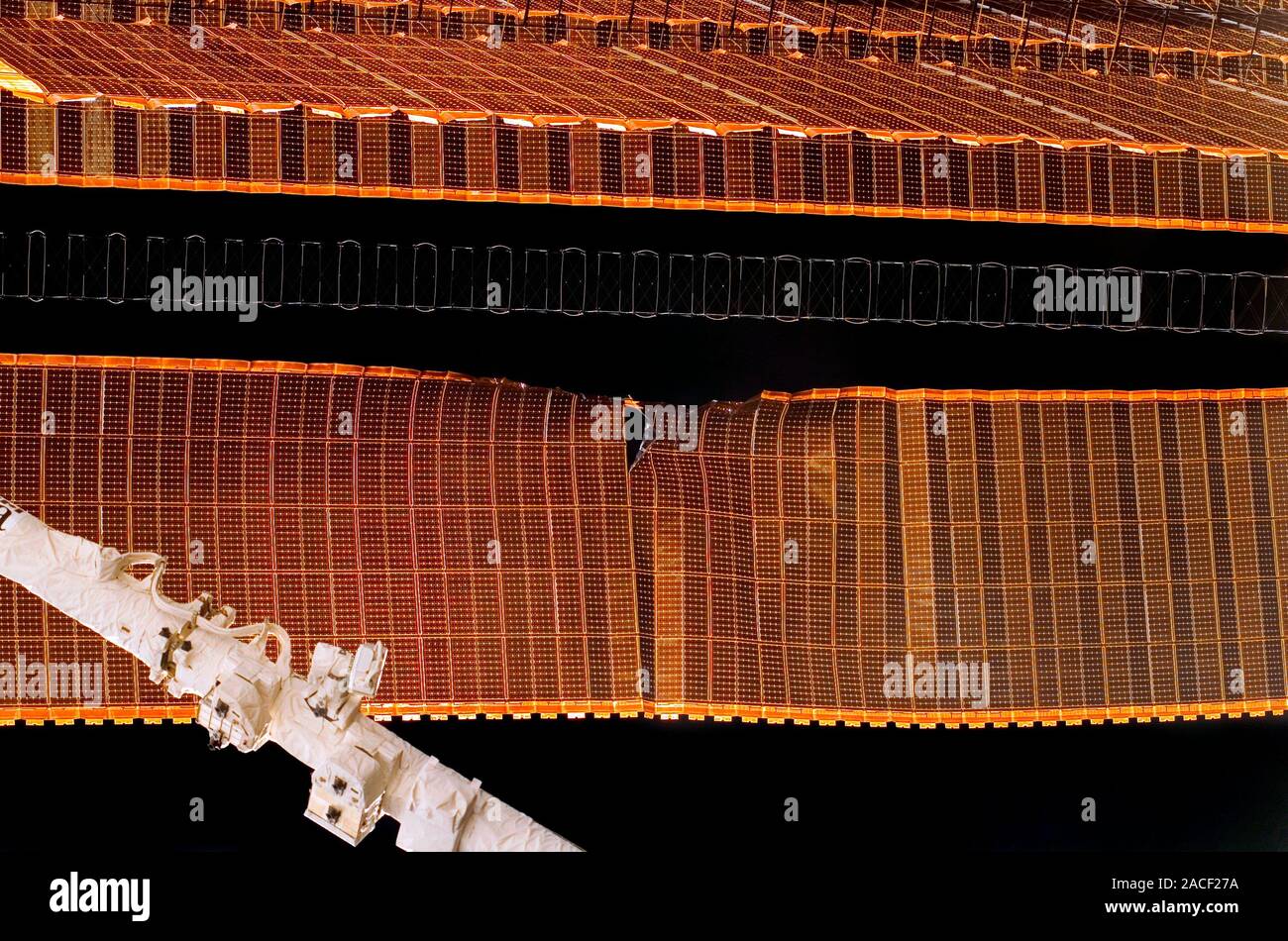 Damaged ISS solar array. View of a damaged solar array wing on the ...