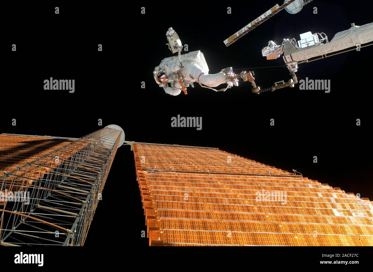 ISS solar array repair. NASA astronaut Scott Parazynski carrying out a ...