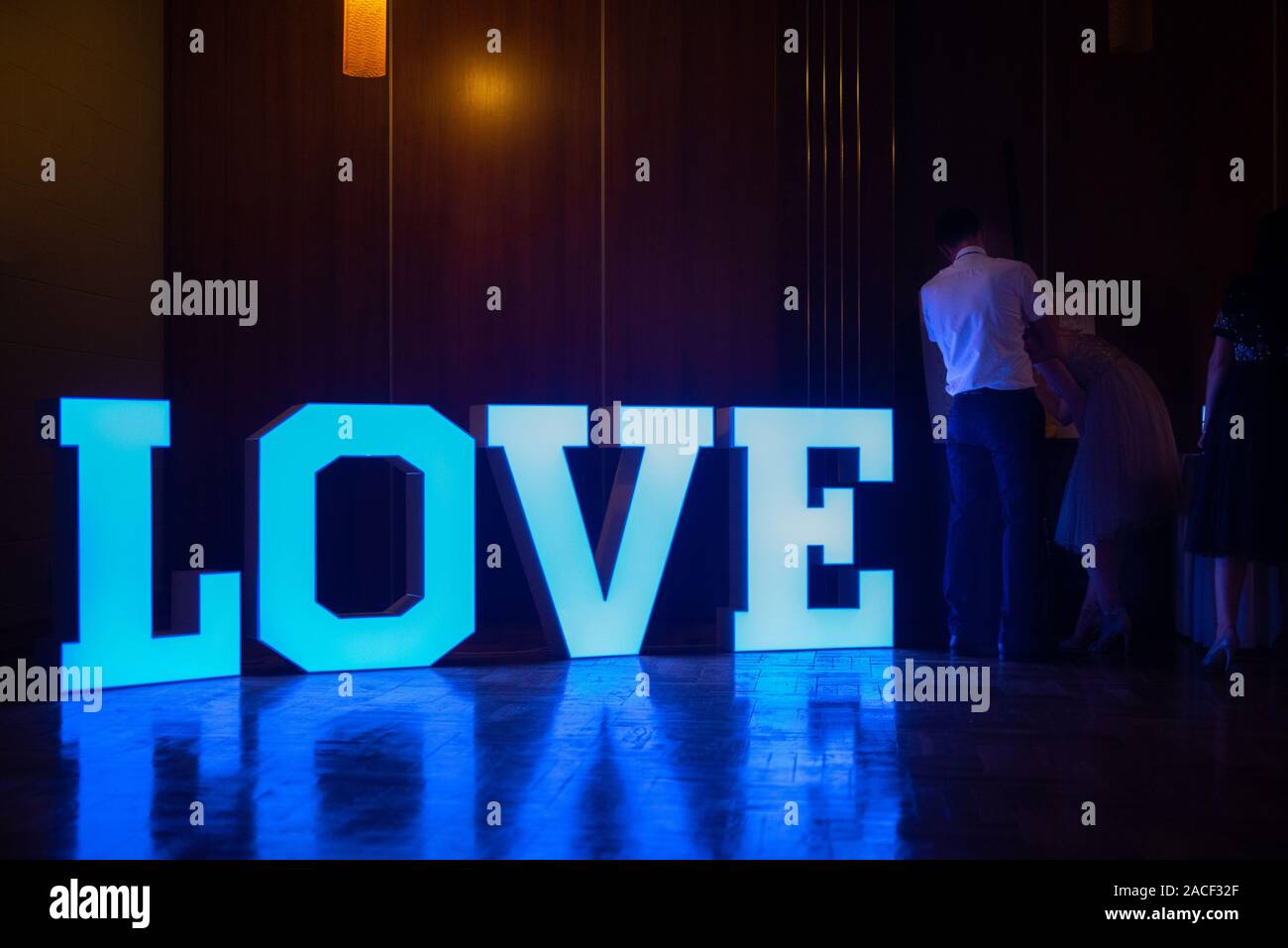 Illuminated Love sign in large letters at a wedding reception Stock ...