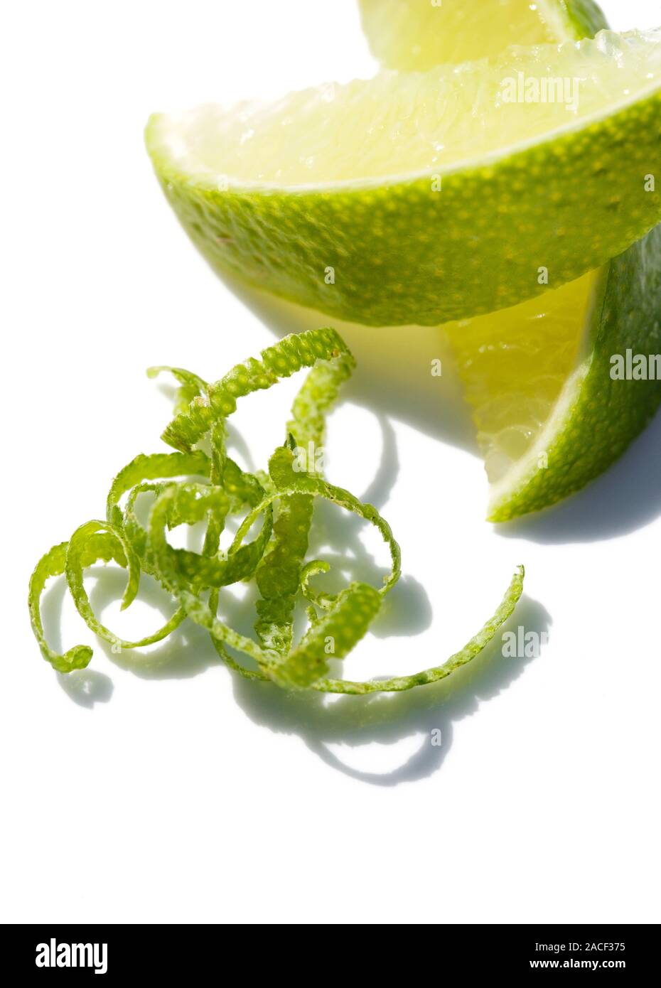 Lime slices and peel. Limes (Citrus aurantifolia) are a good source of ...