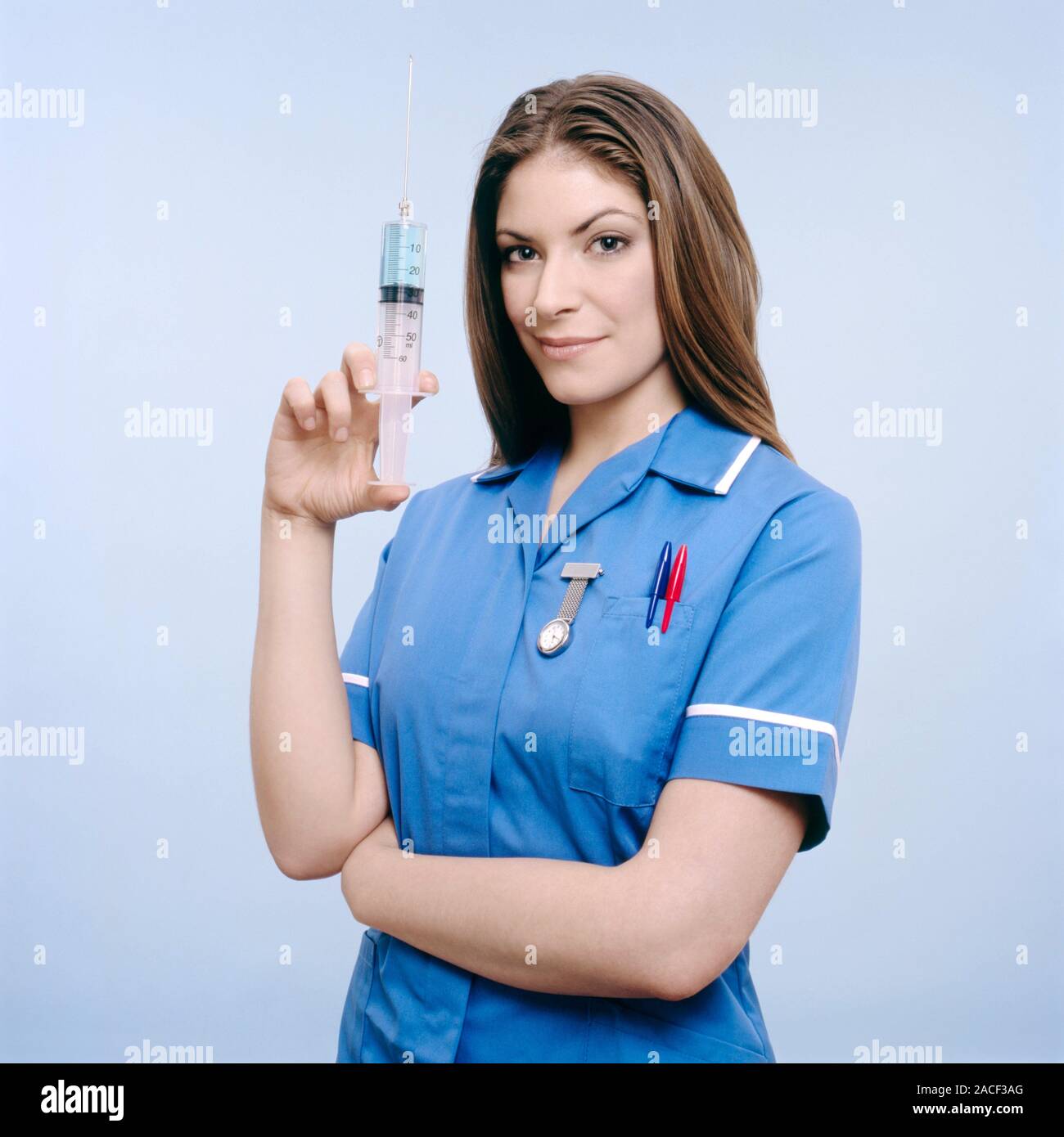 Nurse pumping a syringe Stock Photo - Alamy