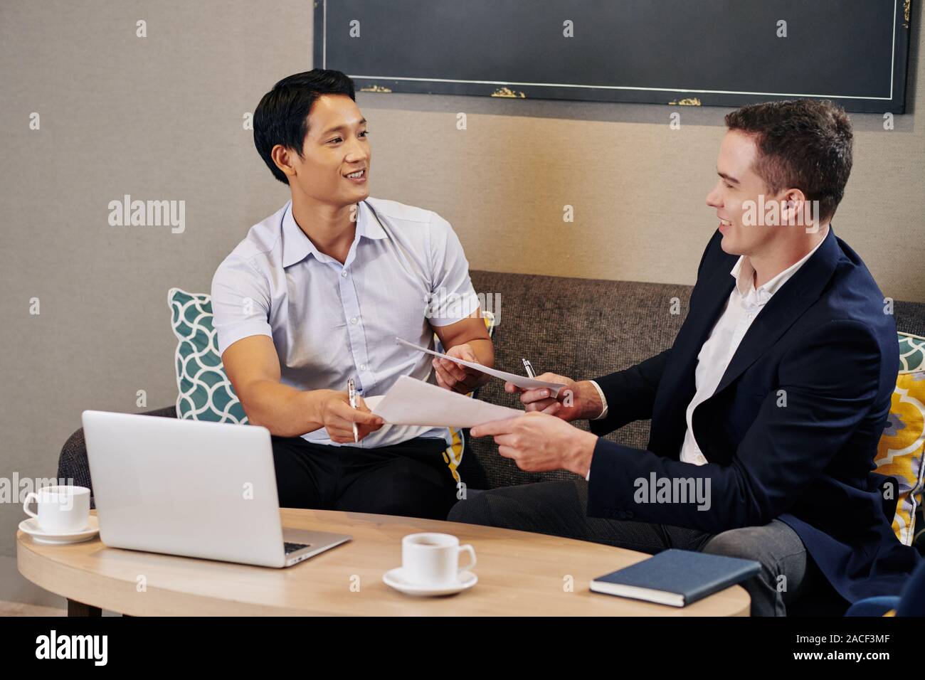 Exchanging contracts hi-res stock photography and images - Alamy