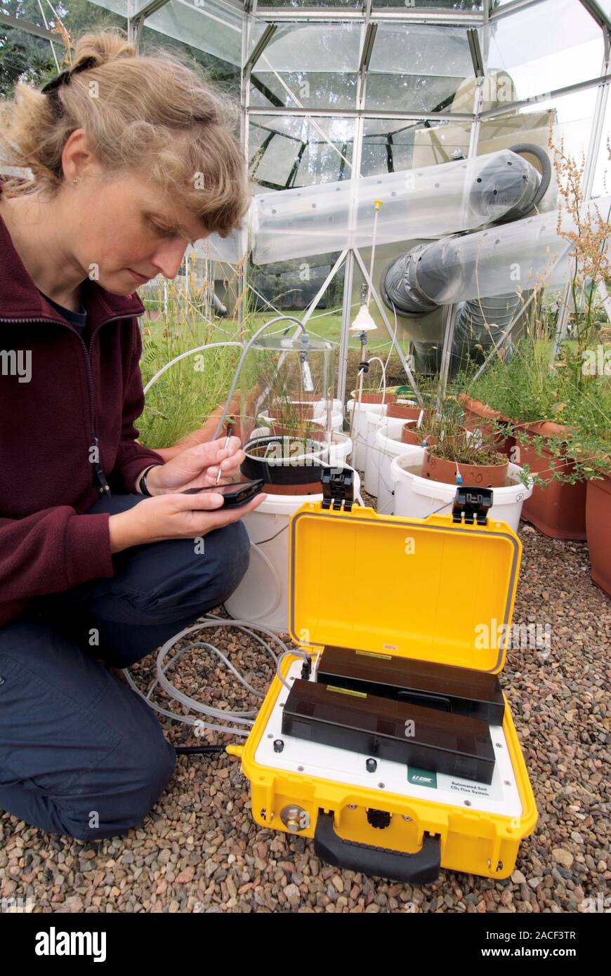 Pollution research. Researcher monitoring the methane and carbon ...