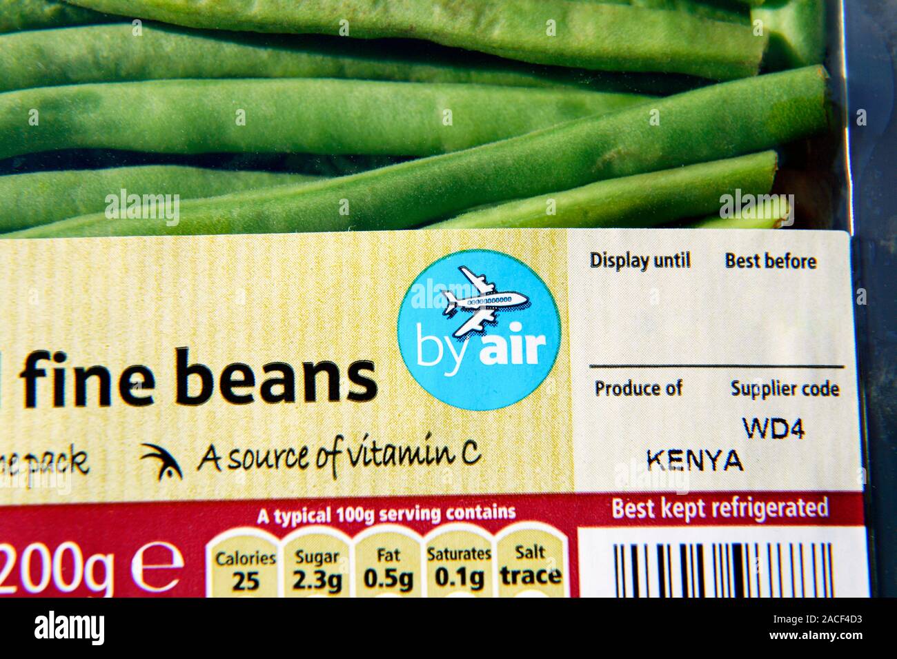 Food miles. By air sticker on a packet of fine beans. Food miles are ...