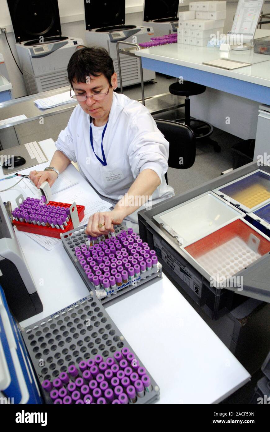 Barcode scanning of donated blood. Haematologist scanning vacutainer ...