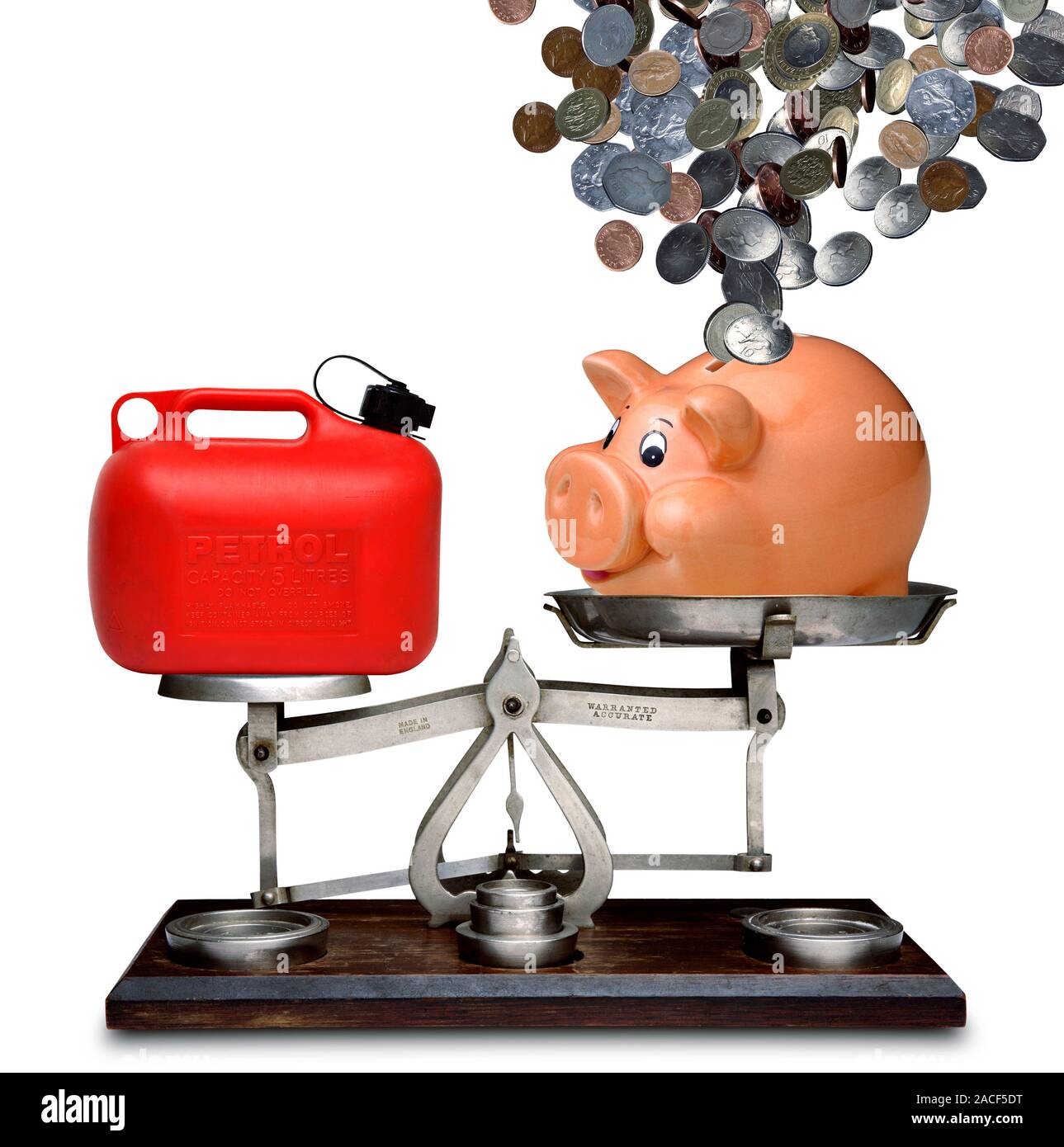 Cost of fuel, conceptual image. Can of fuel balanced on a set of scales ...