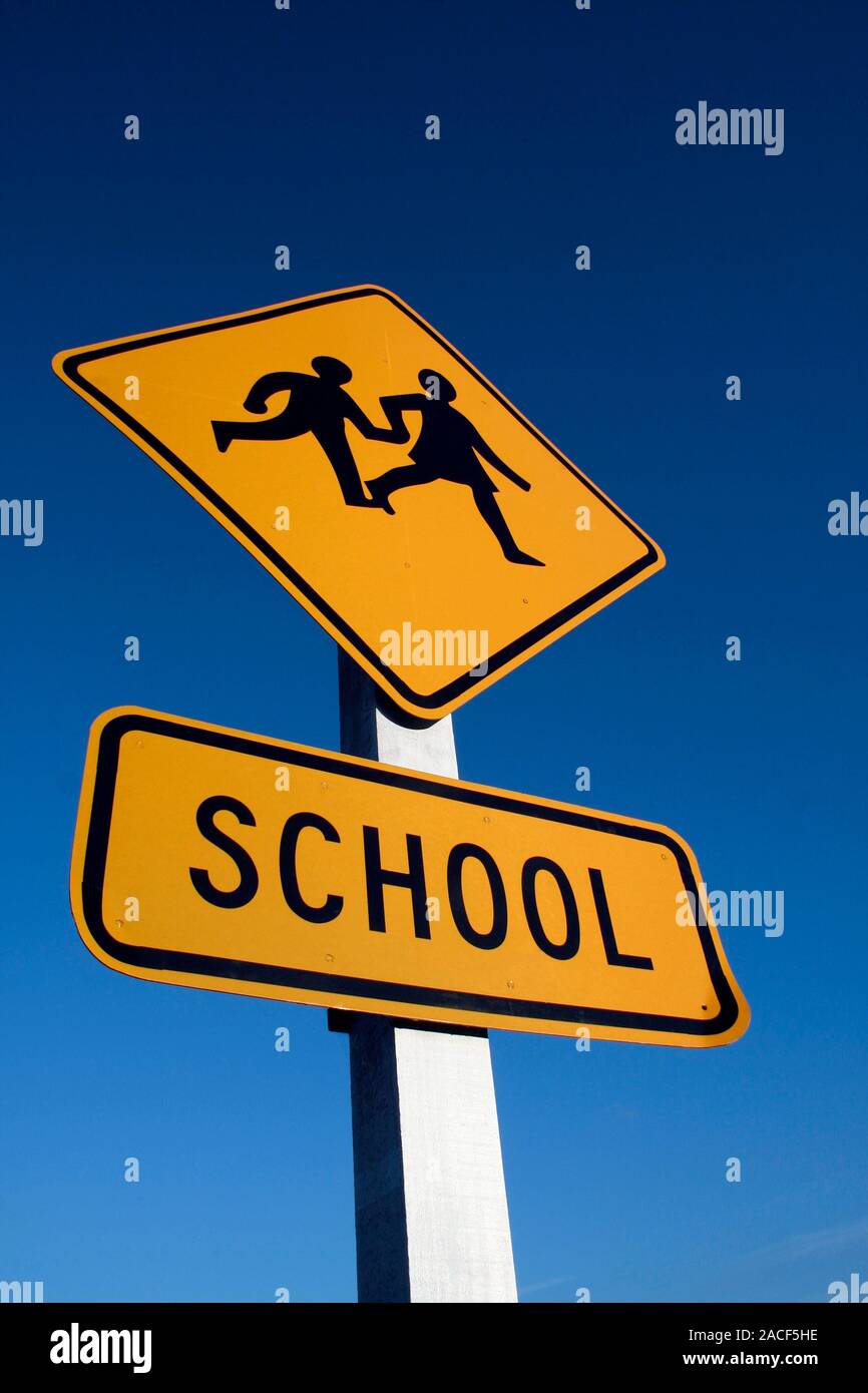 New Zealand road sign. Road sign indicating a school crossing ahead. Photographed in Opotiki ...