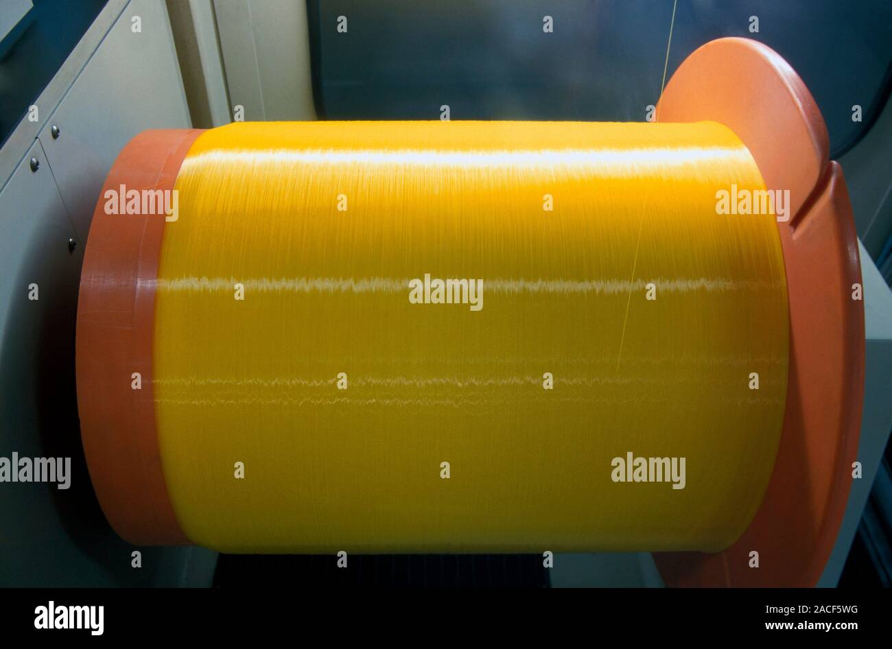 Fibre optics manufacturing. Reel of optical fibres at a factory ...