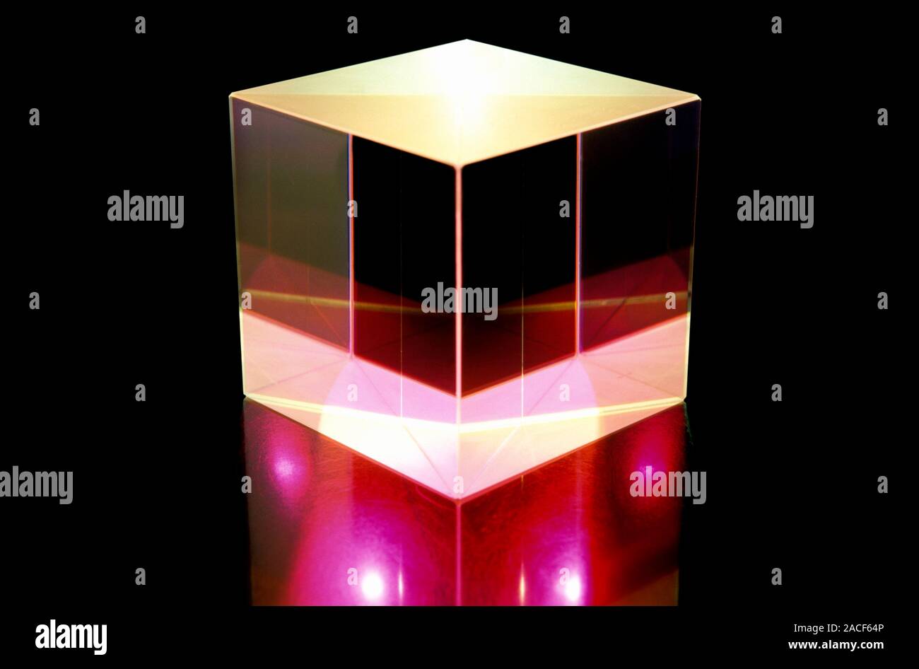 Glass cube optical component. This glass cube, seen reflecting and ...