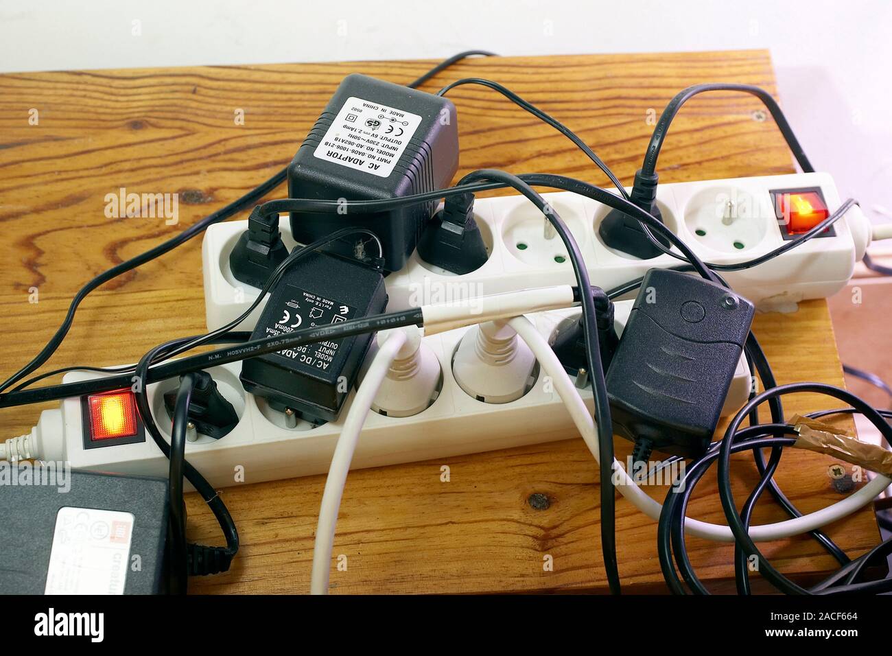 Heavily loaded plug socket. A multi-plug adapter with a number of ...