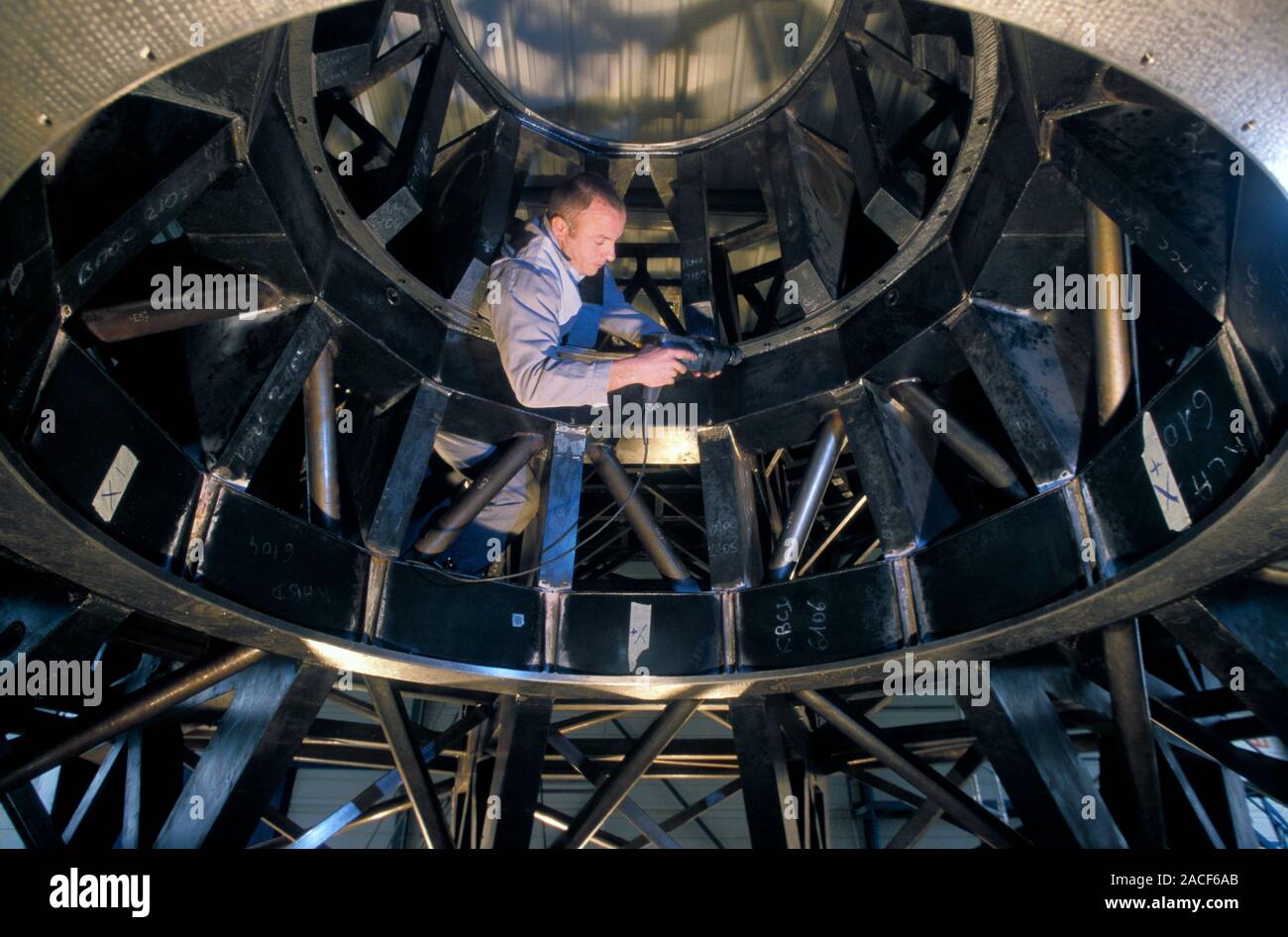 Very Large Telescope (VLT) construction. Engineer working on the M1 ...