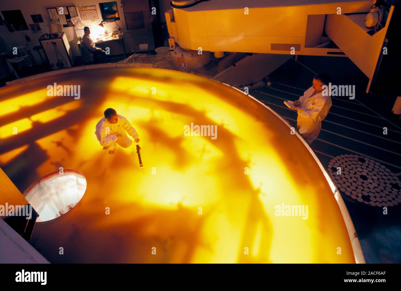 Very Large Telescope (VLT) mirror inspection. Engineers checking the ...
