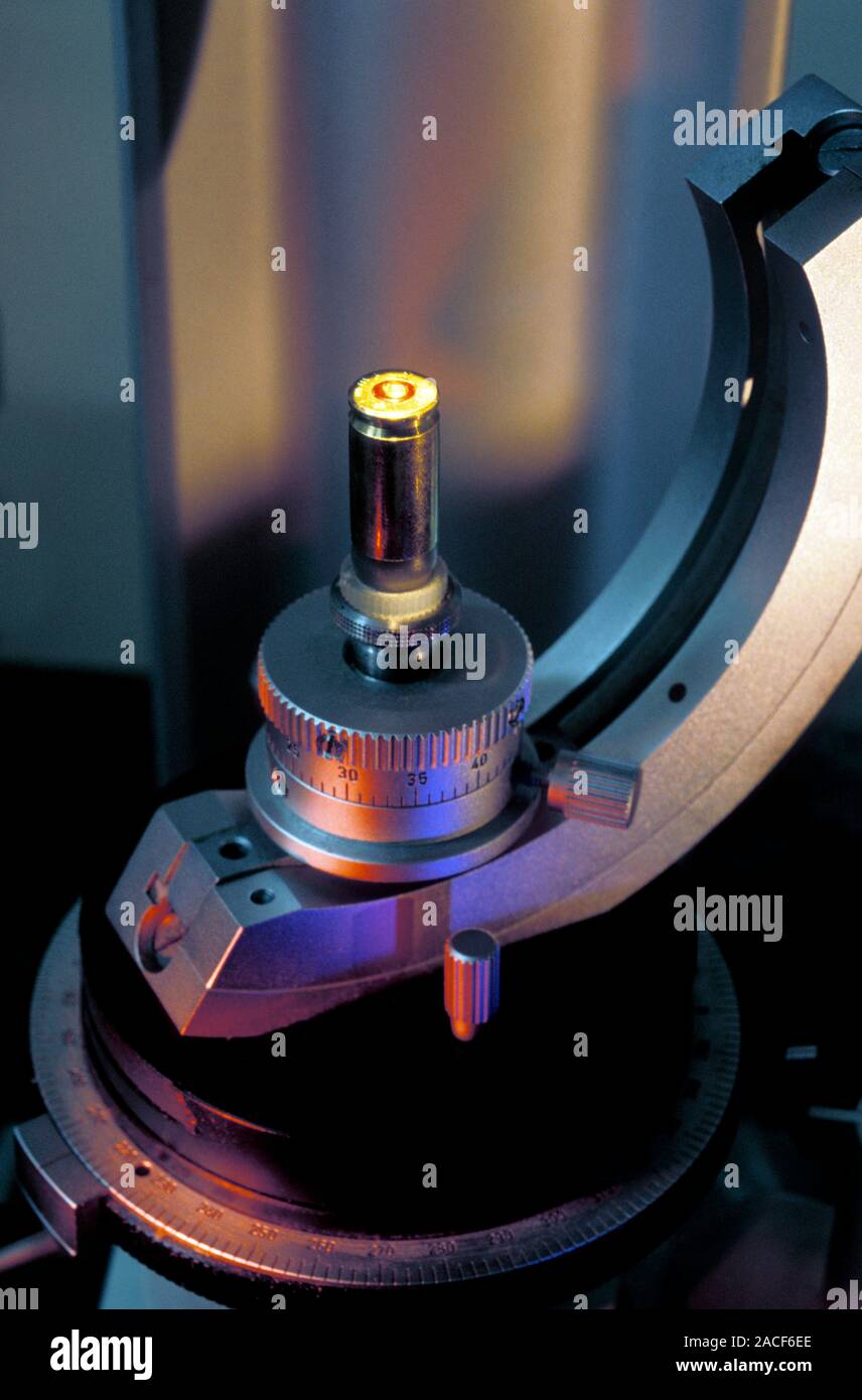 Forensic ballistics test. Crime scene bullet cartridge being examined ...