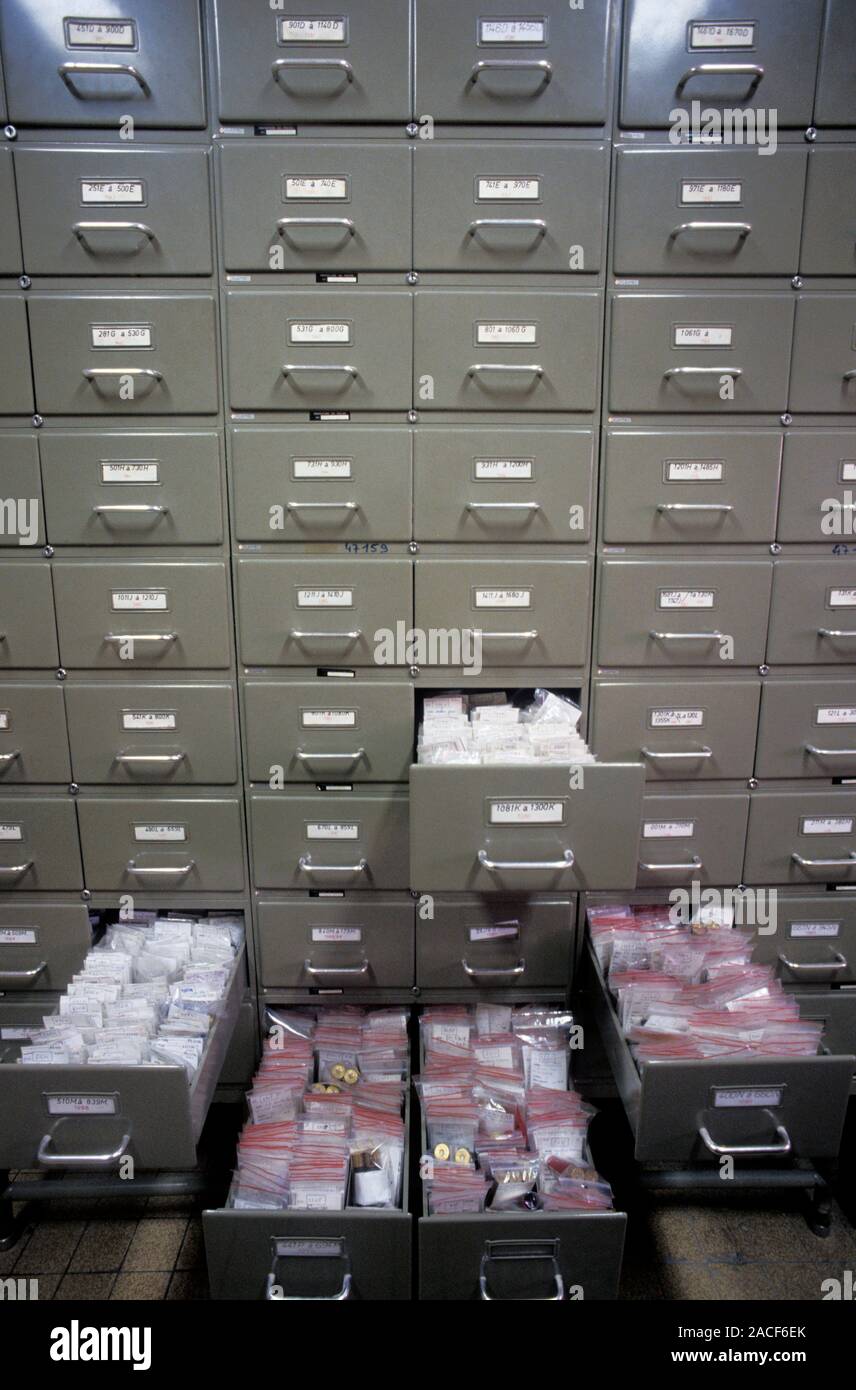 Forensic ballistics evidence. Filing cabinet of evidence obtained by ...