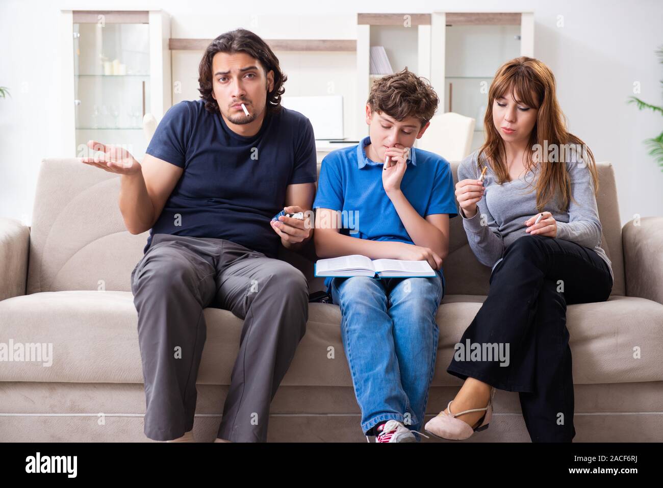 The concept of underage smoking with young boy and family Stock Photo ...