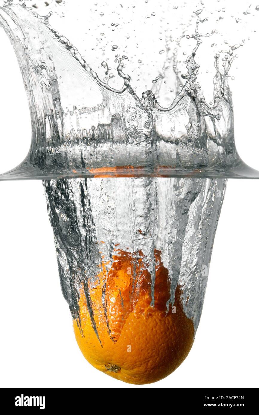 Orange impacting water, high-speed image. The impact of the orange has ...