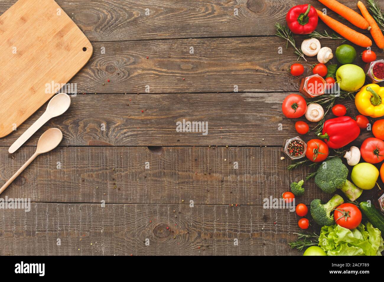 Left board and spoons on the right vegetables Stock Photo - Alamy