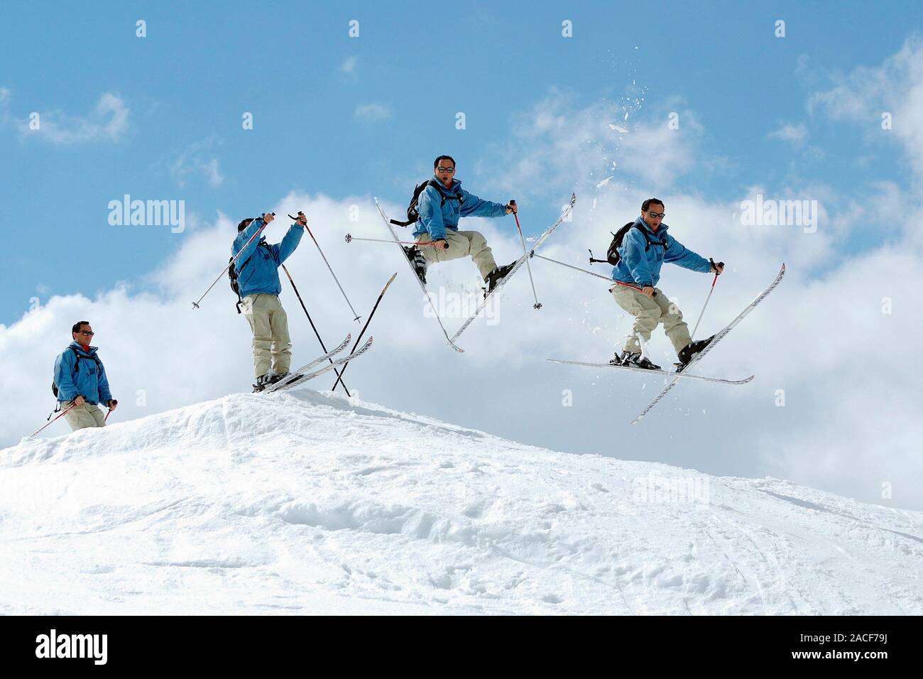 Ski jumping. Composite sequence of four images of a skier performing an ...