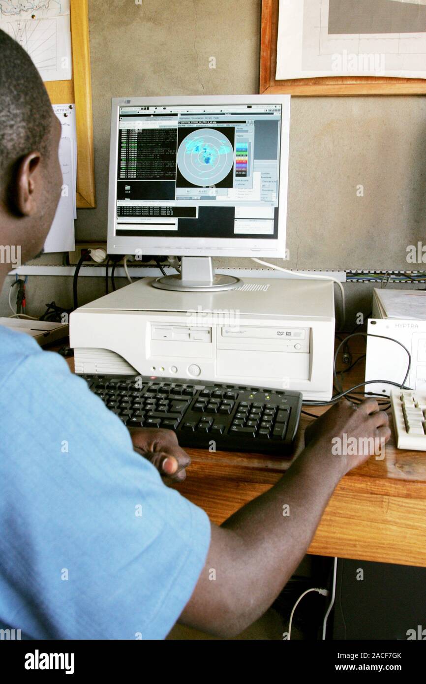 Monsoon research. Meteorologist looking at a radar weather map covering ...