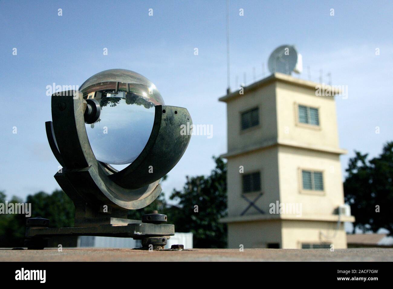Heliometer (left) and weather station. The heliometer is used to ...