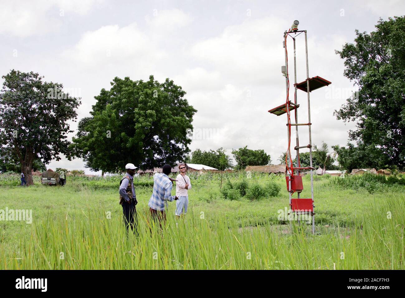 Scintillometer measurements. Meteorologists inspecting a weather ...