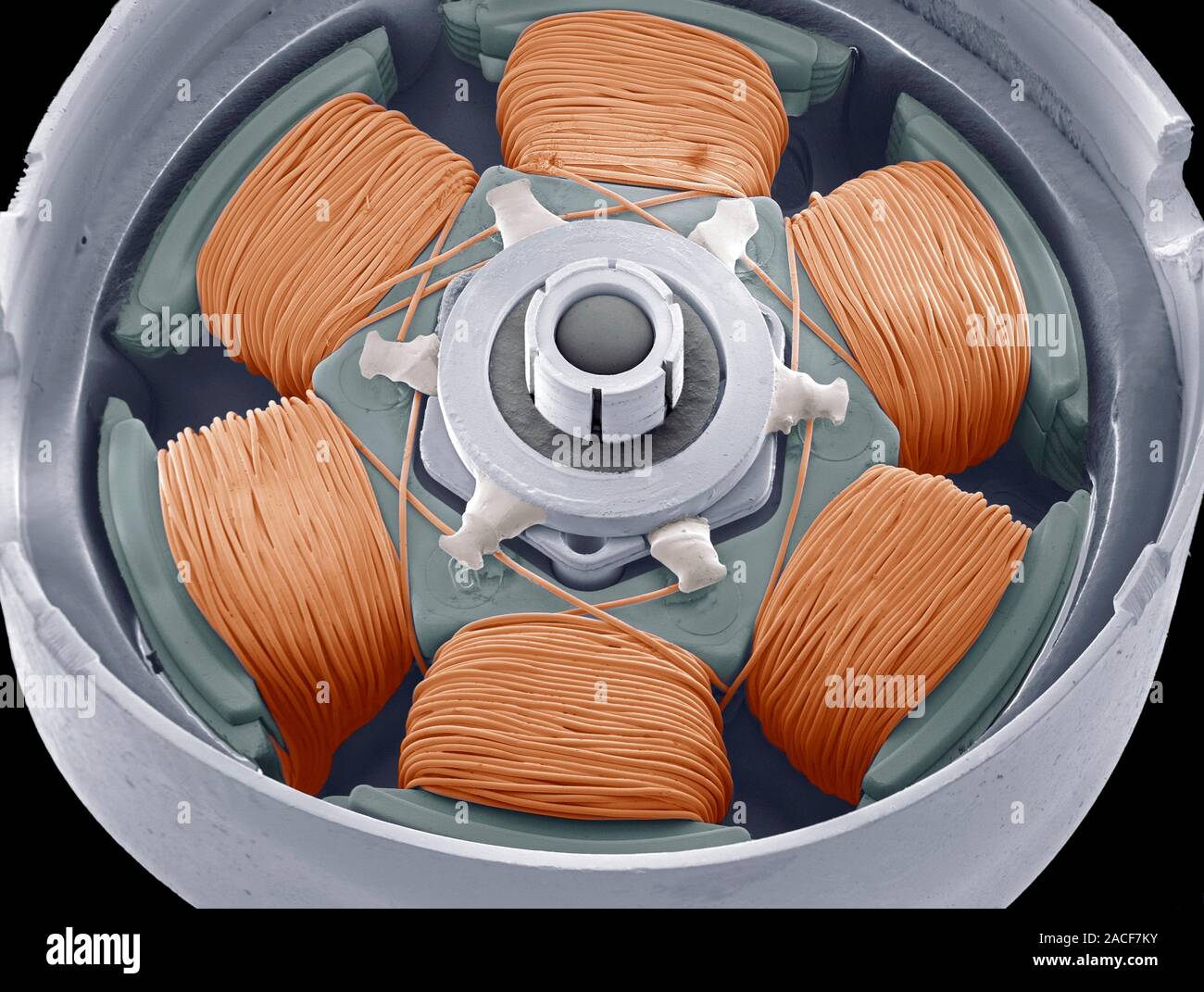 DVD drive motor. Coloured scanning electron micrograph (SEM) of the ...
