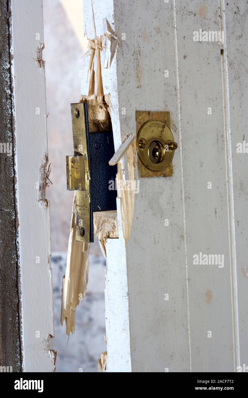Burglary damage. Door and lock damaged during a burglary Stock Photo ...