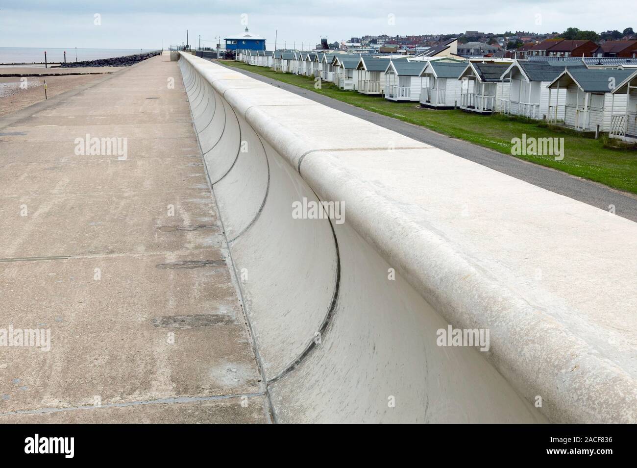 Coastal defences. Sea wall protecting beach huts at Hunstanton, Norfolk ...