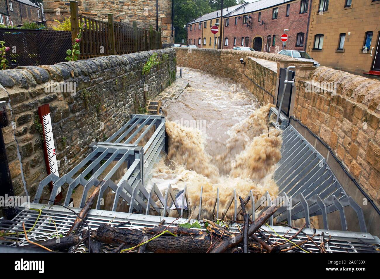 Flood alleviation scheme. Floodwater running through the Cockshaw Burn ...