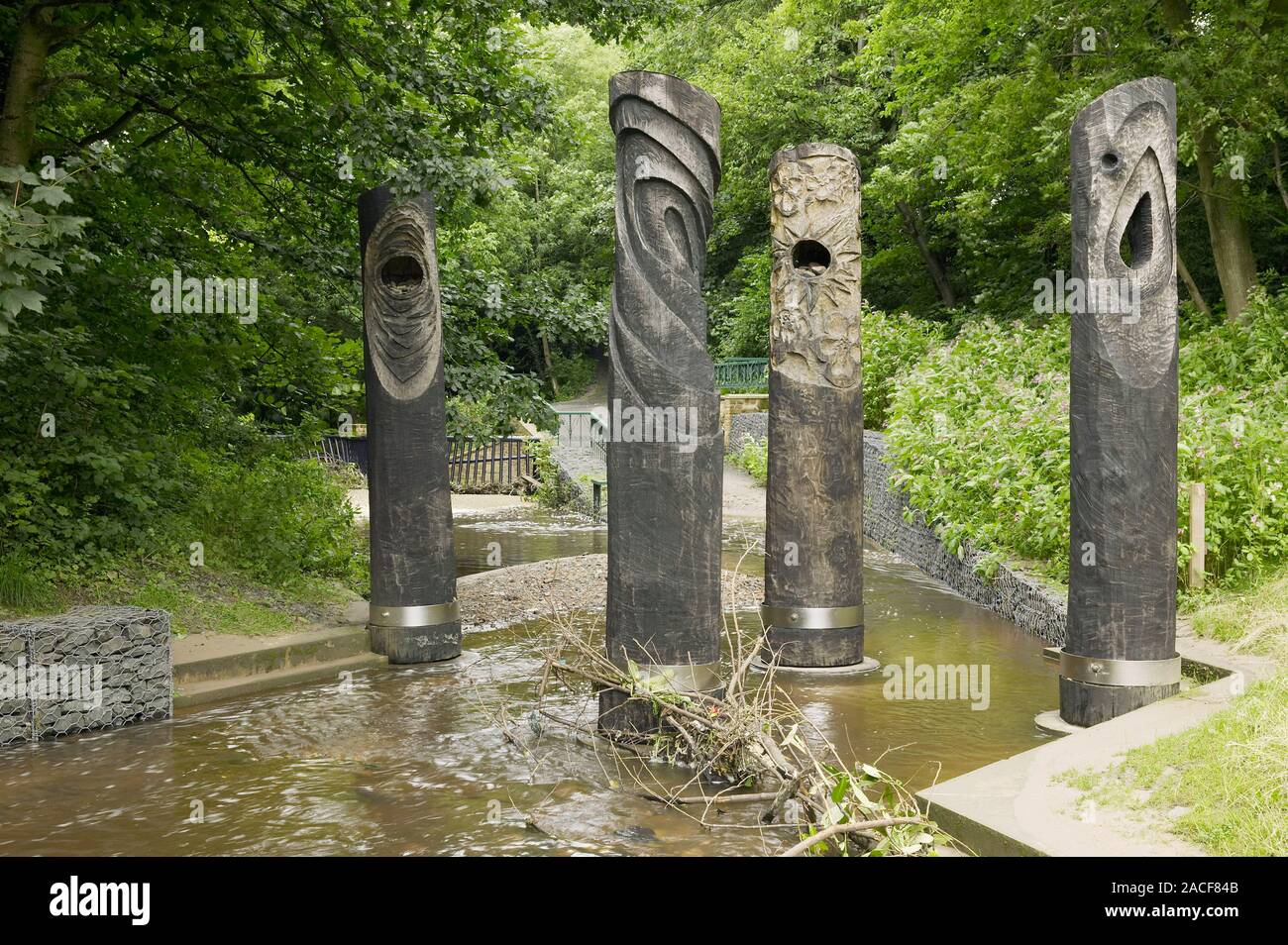Flood barrier. Totem poles seen after a flood. These serve as a barrier ...