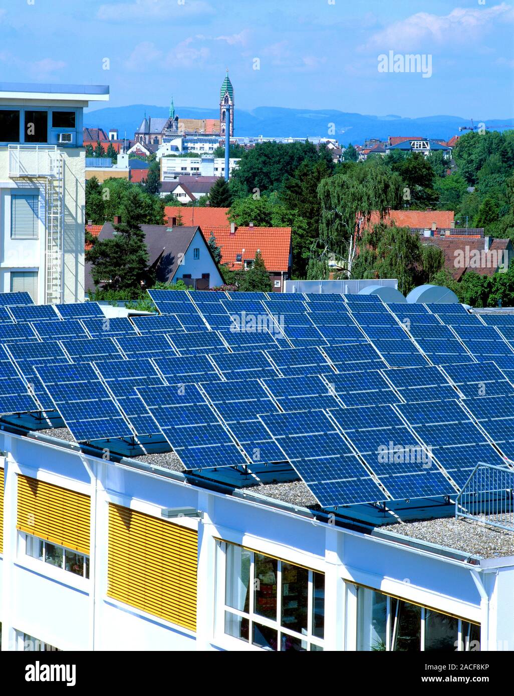 Rooftop solar panels. Arrays of photovoltaic cells on the roof of an ...