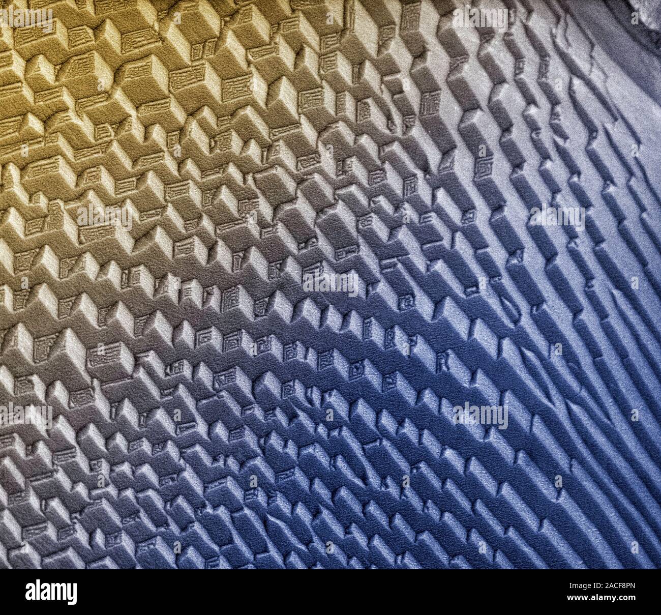 Titanium crystals. Coloured scanning electron micrograph (SEM) of the ...