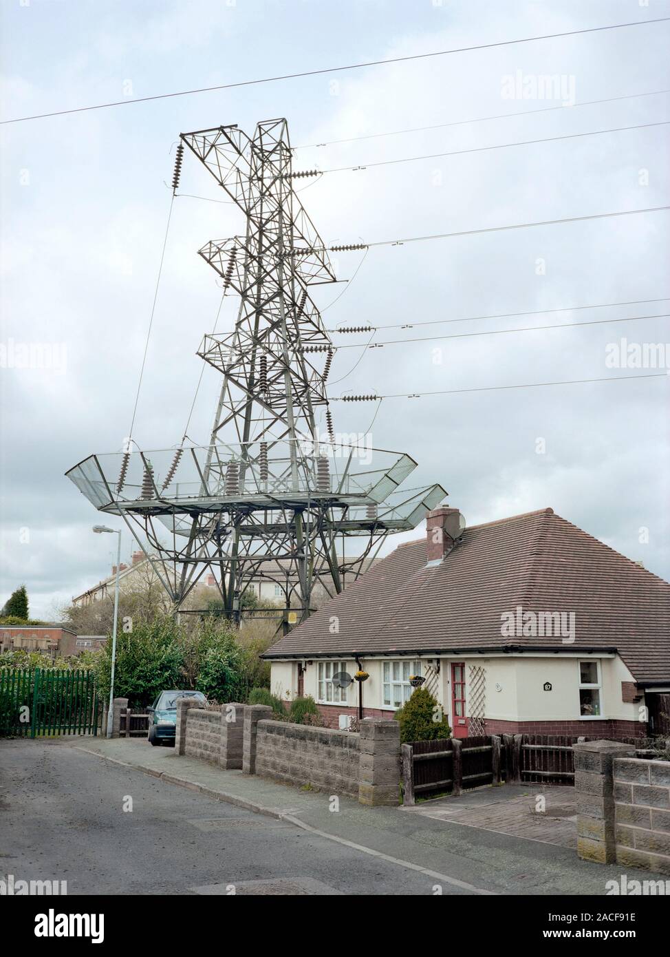 Electricity pylon. Pylon supporting electric power lines passing over a ...
