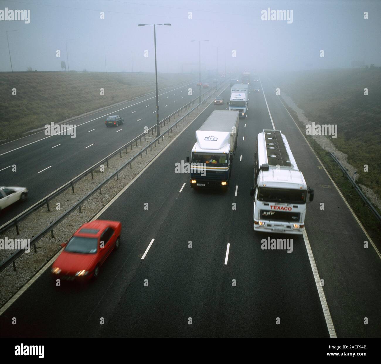 Motorway traffic in fog. Photographed in the UK Stock Photo - Alamy