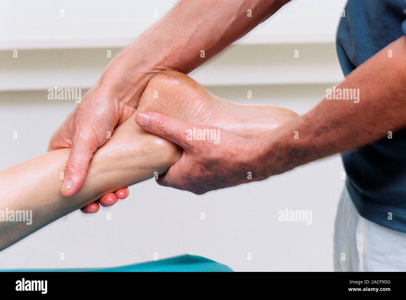 Foot manipulation. Patient having their ankle and foot joints ...