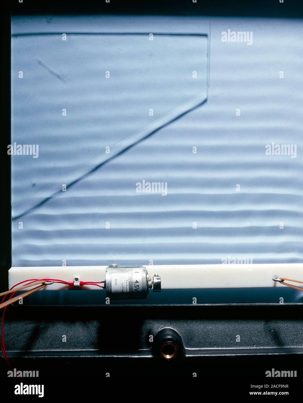 Refraction in water waves. Waves of water travel more slowly in ...