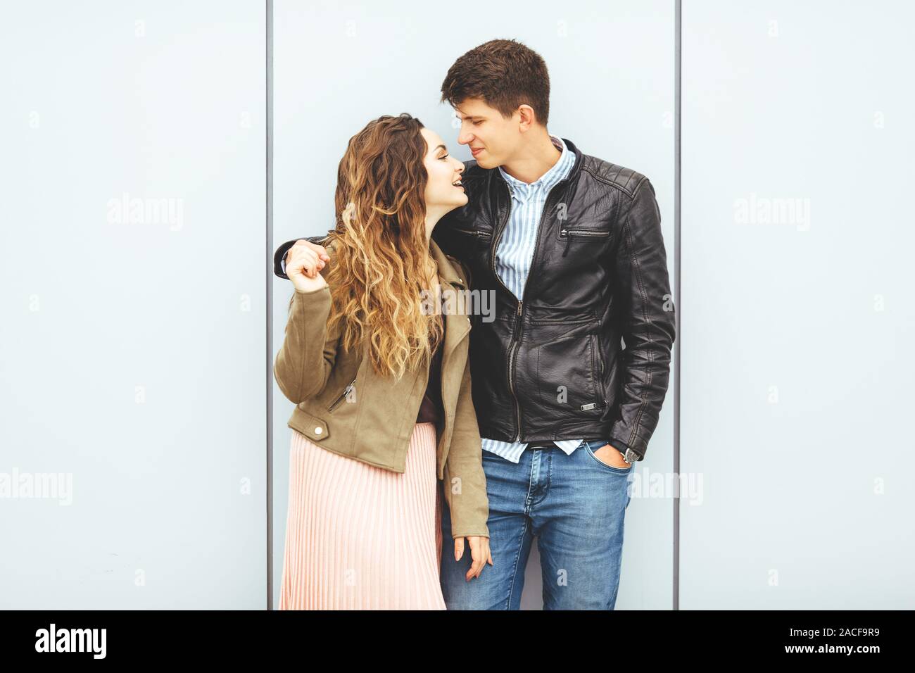 Happy loving couple isolated on gray background. stylish image, good ...