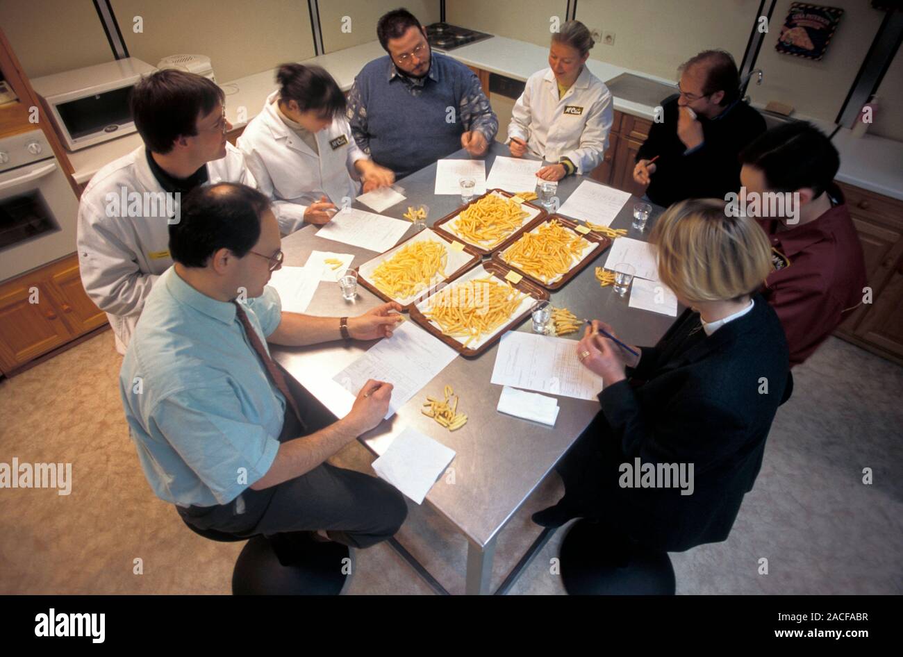 Frozen chip factory, workers sampling chips. Chips are taken from every ...