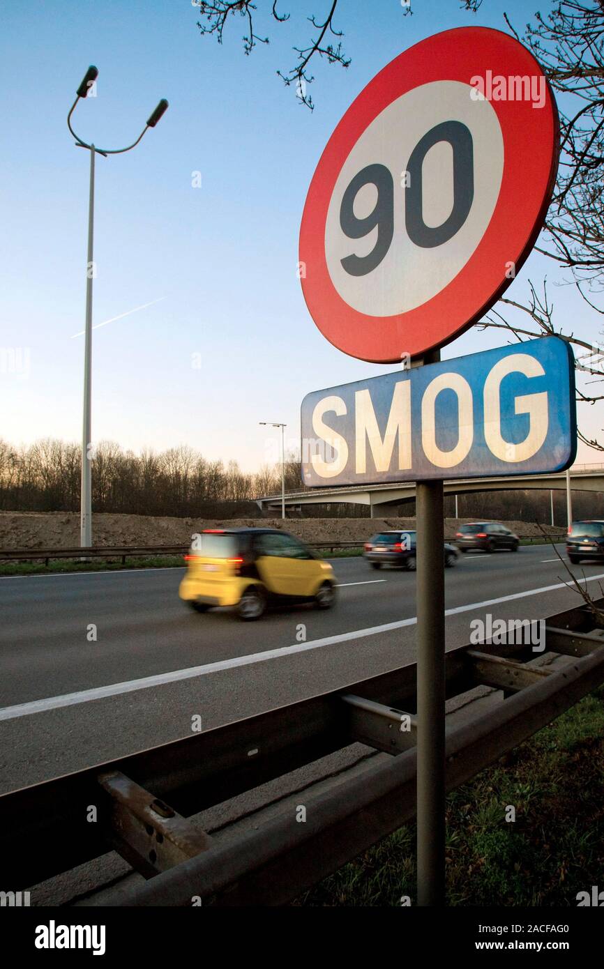 Road sign. Road sign indicating maximum speed limit and smog ahead ...