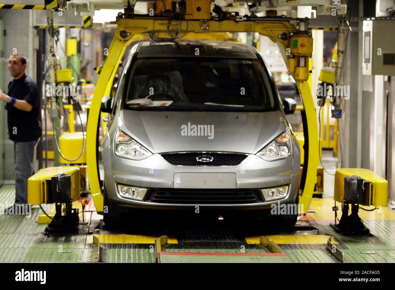 Ford car assembly line. Completed Ford Mondeo emerging from the end of ...