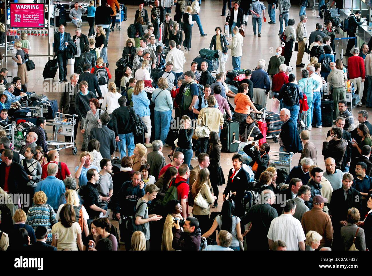 Airport delays. Crowd of people waiting for delayed flights at an ...