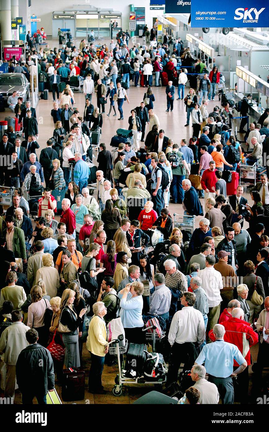 Airport delays. Crowd of people waiting for delayed flights at an ...